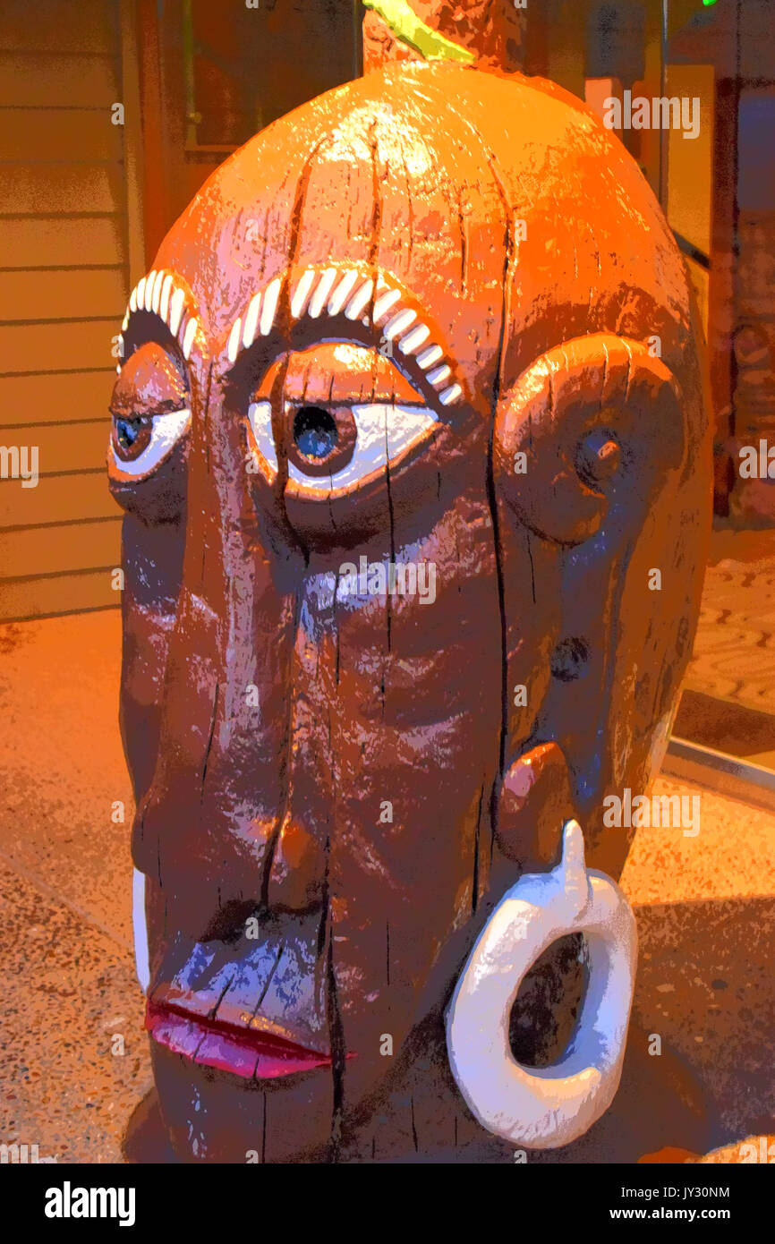 Wood carving of a primitive face Stock Photo - Alamy