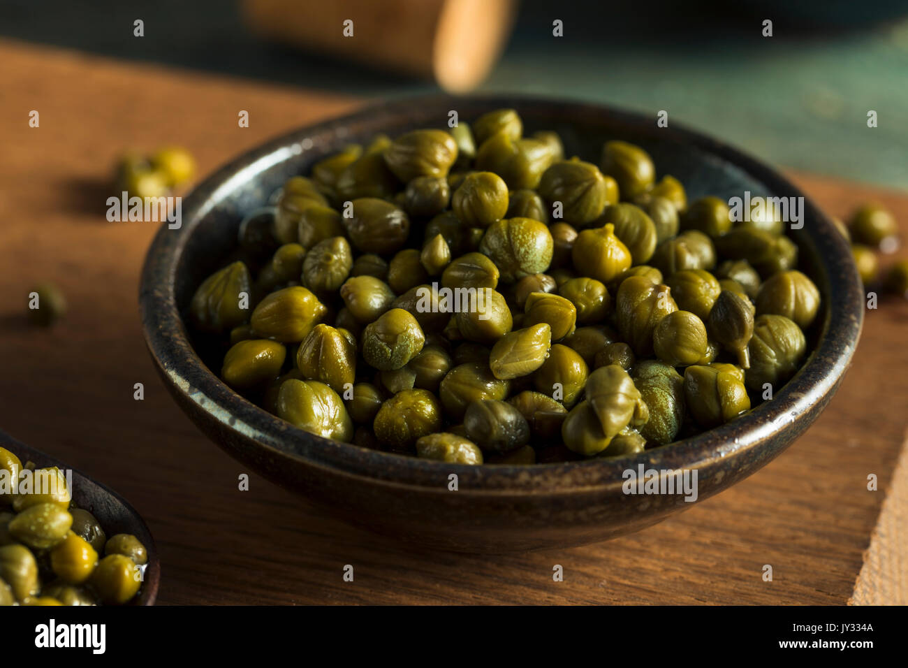 Raw Green Organic Marinated Capers in a Bowl Stock Photo - Alamy