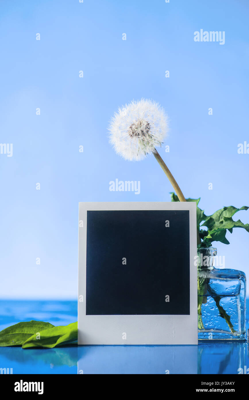 Simple still life with instant photo frame, summer rain, drops on a ...