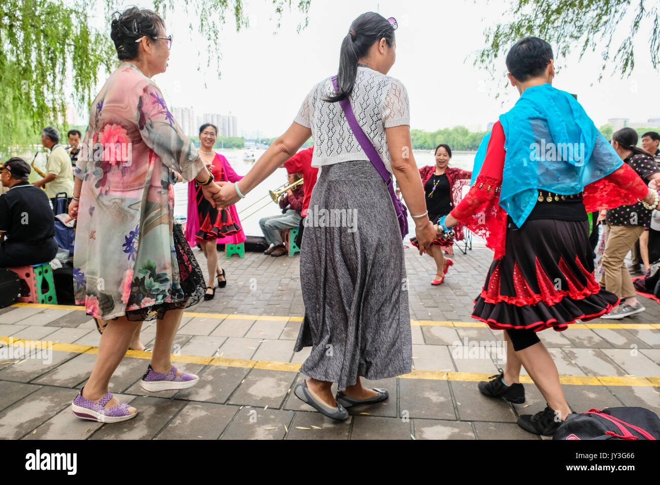China females holding hands hi-res stock photography and images - Alamy