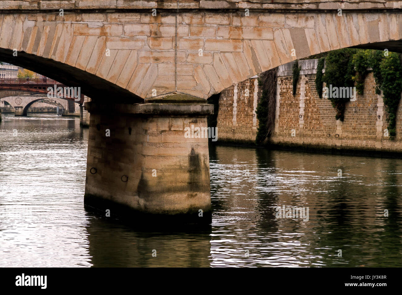 Landmark and touristic spot: old stone bridge over the Seine river in ...