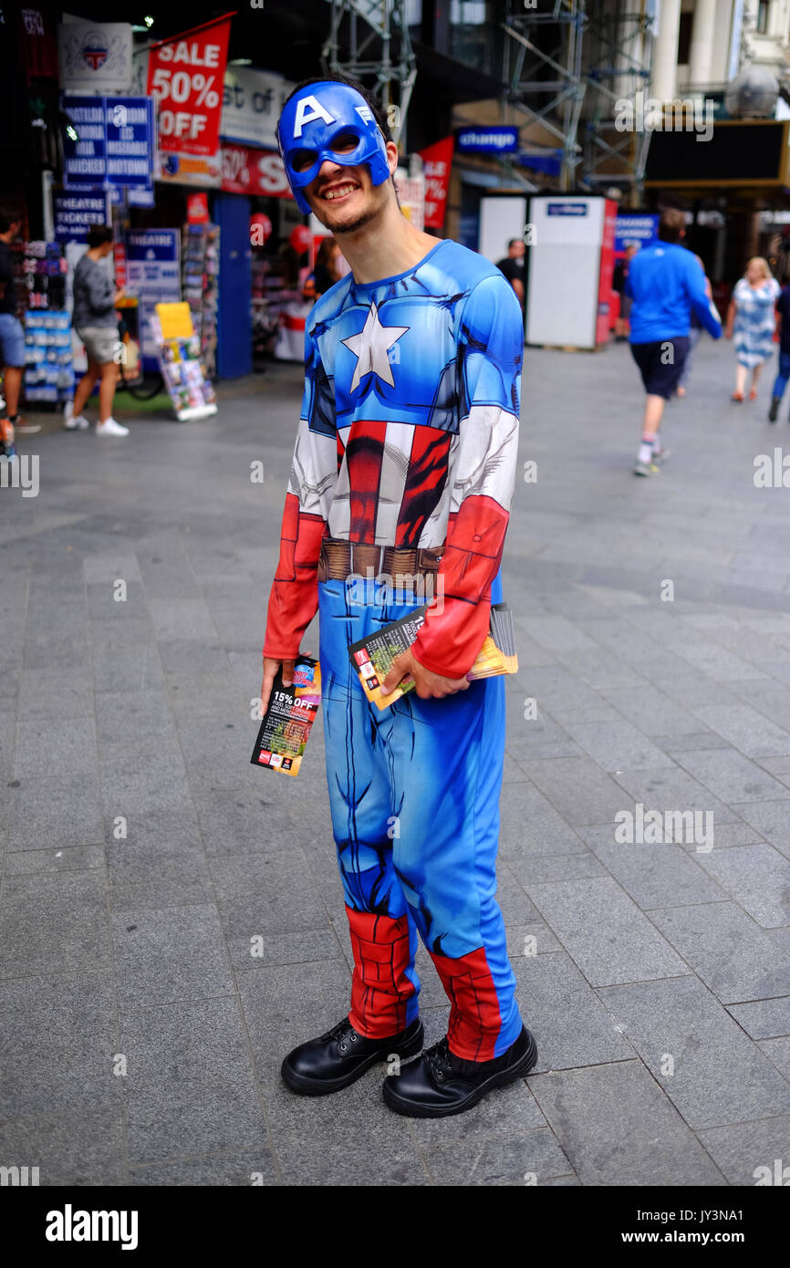 A smiling guy dressed as Captain America giving out vouchers to Planet ...