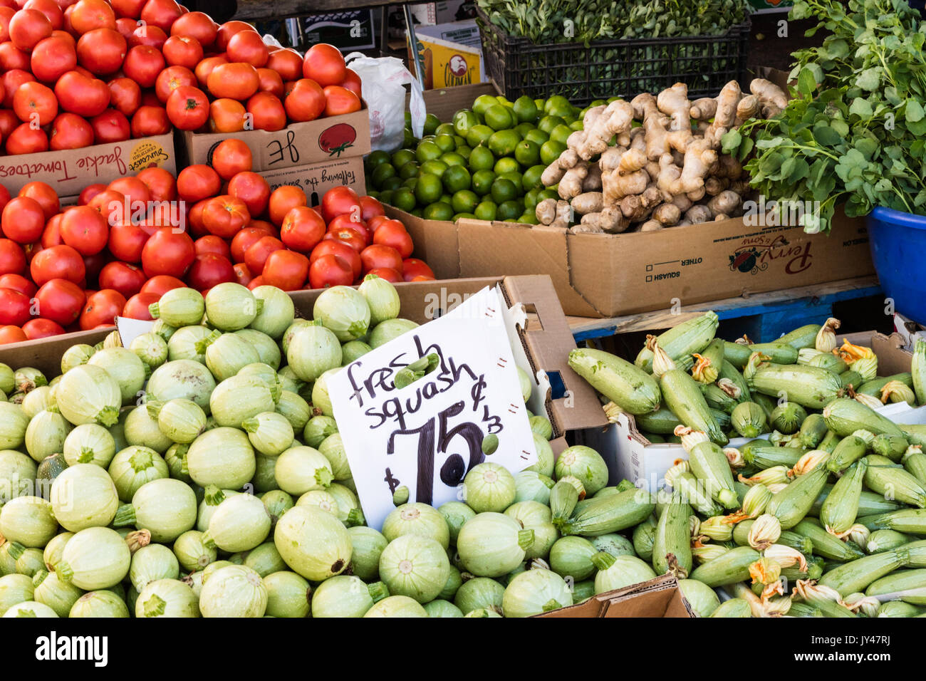 Large display of fresh vegetables at a Farmers market fruit stand in ...