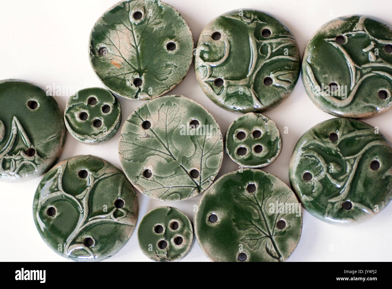 Collection of 11 green ceramic buttons Stock Photo - Alamy