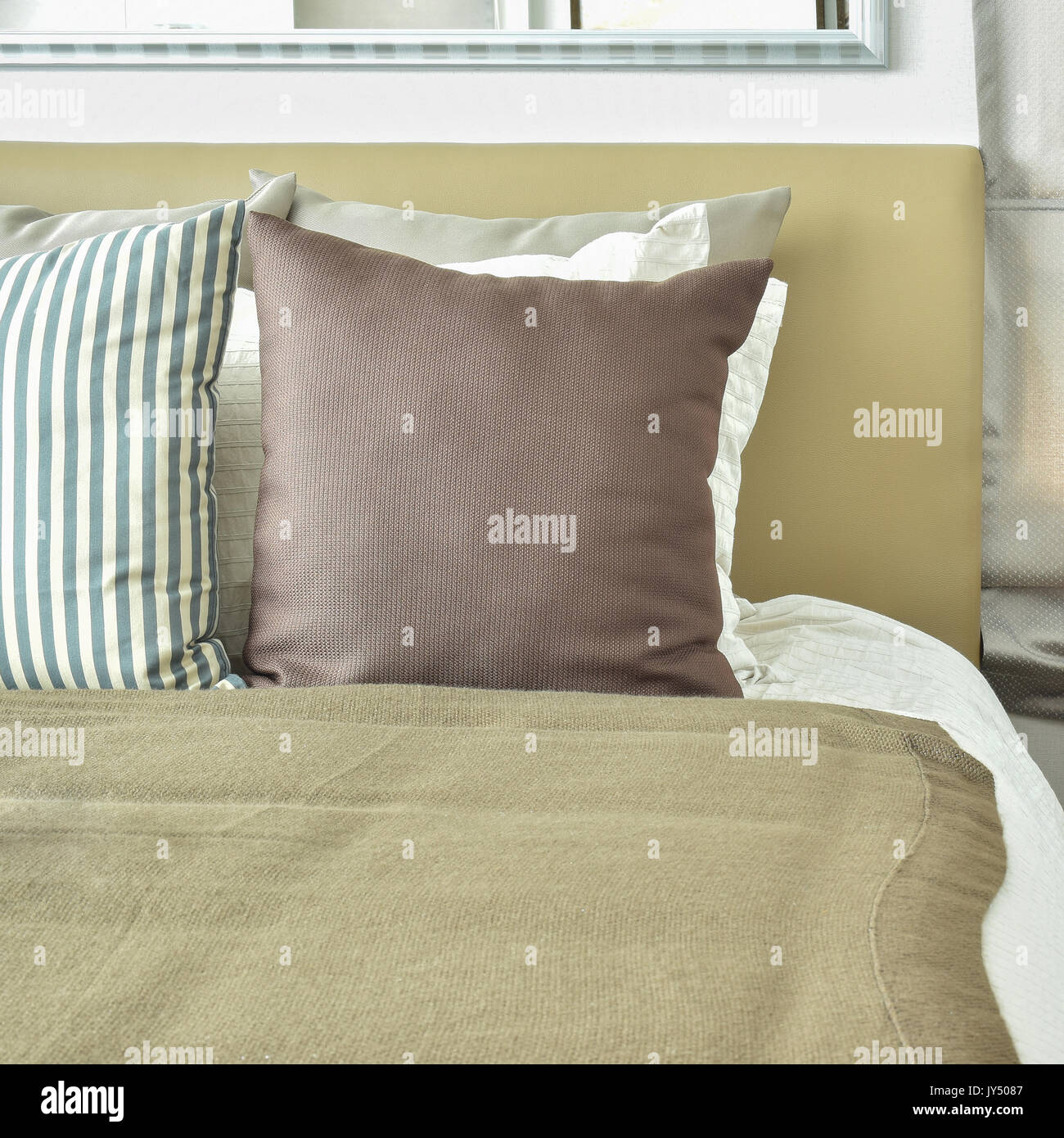 Light brown color scheme bedding with light brown headboard and table ...