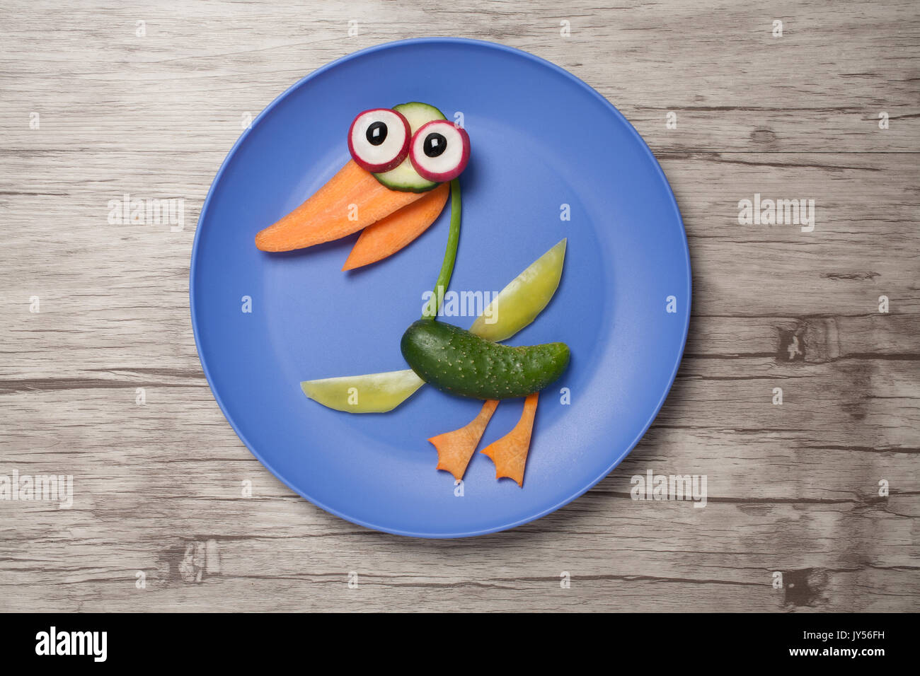 Funny vegetable duck made on plate and wood Stock Photo - Alamy