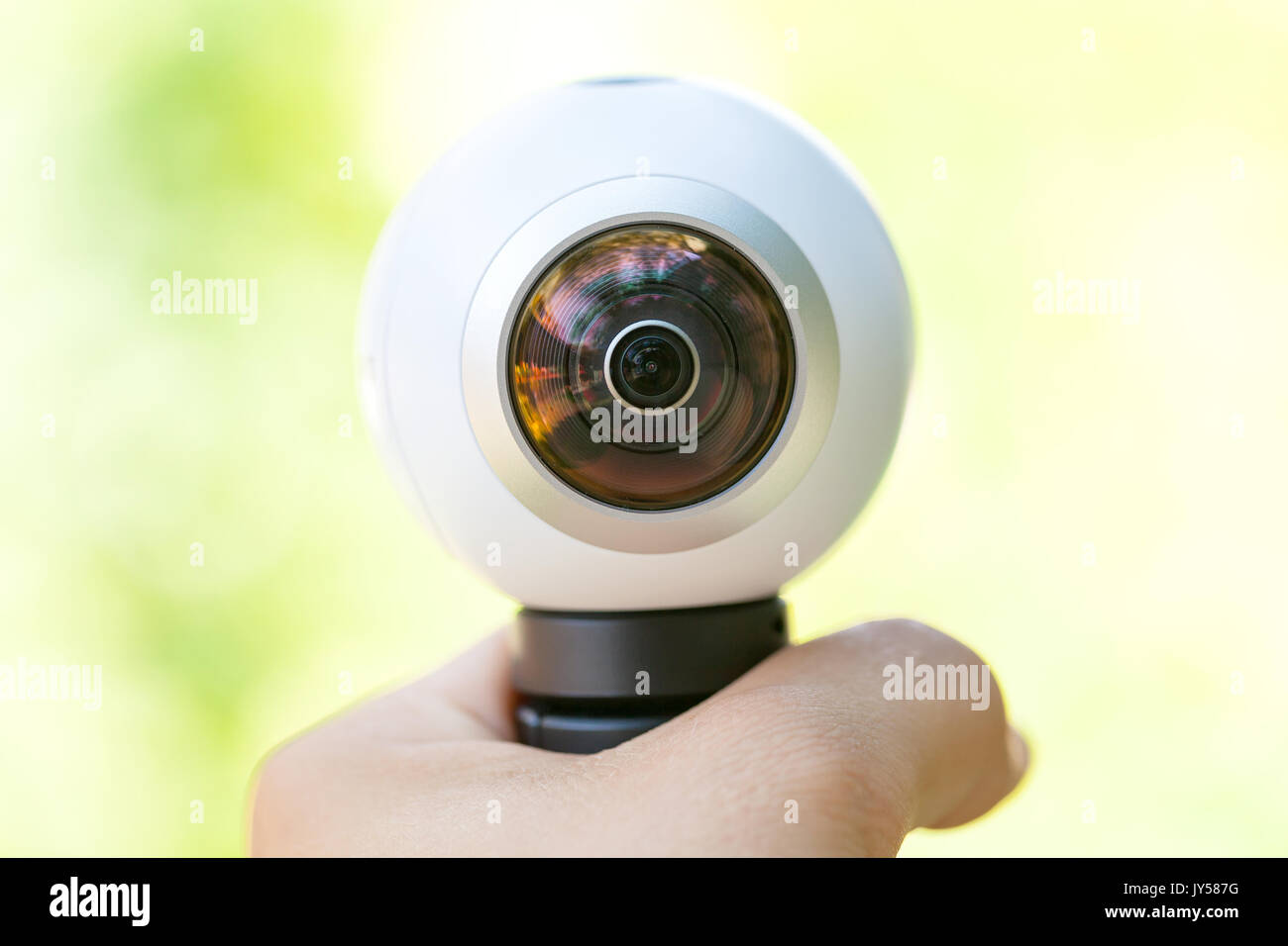 Close up picture of a 360 degree panoramic virtual tour camera in human ...