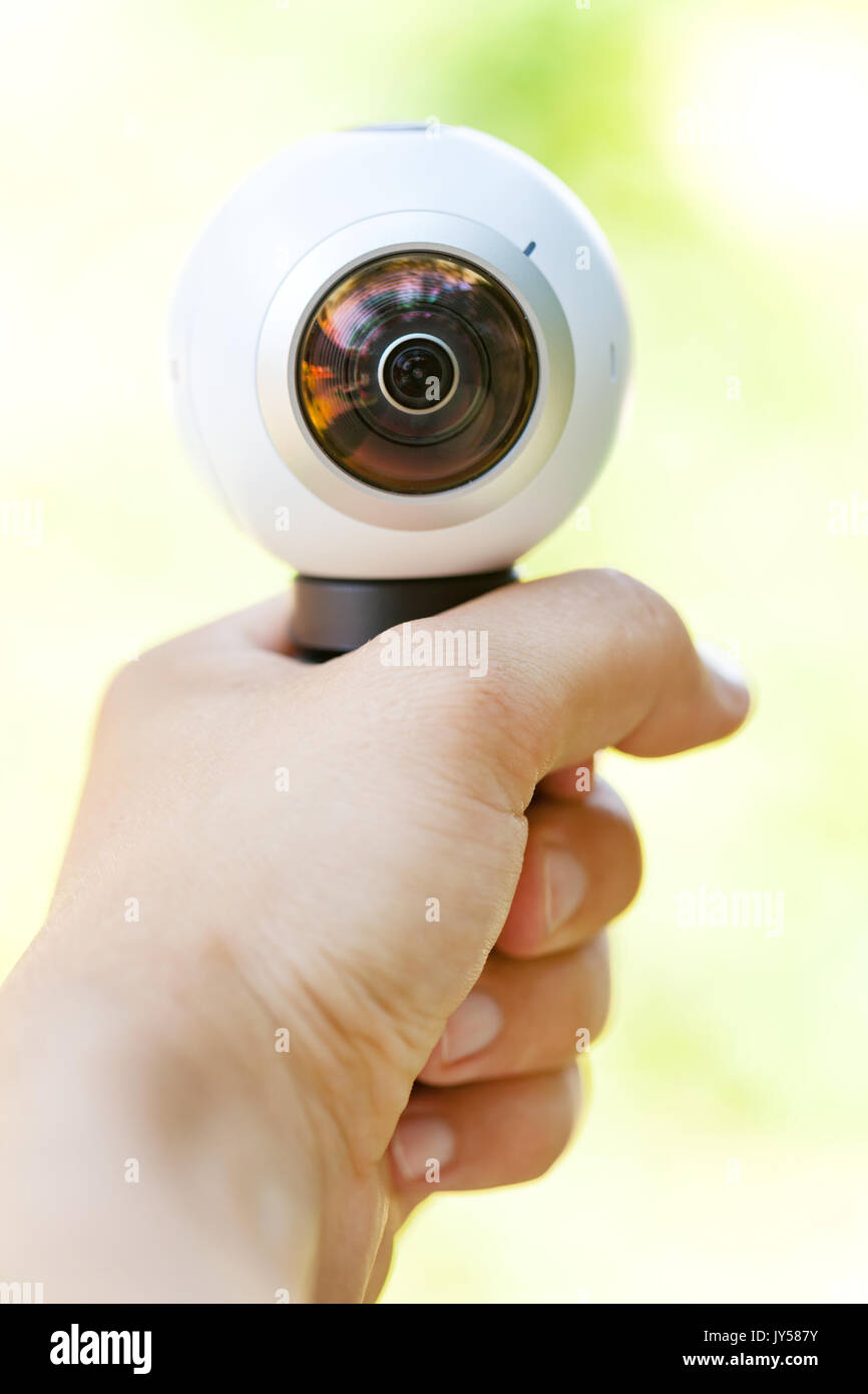 Close up picture of a 360 degree panoramic virtual tour camera in human ...