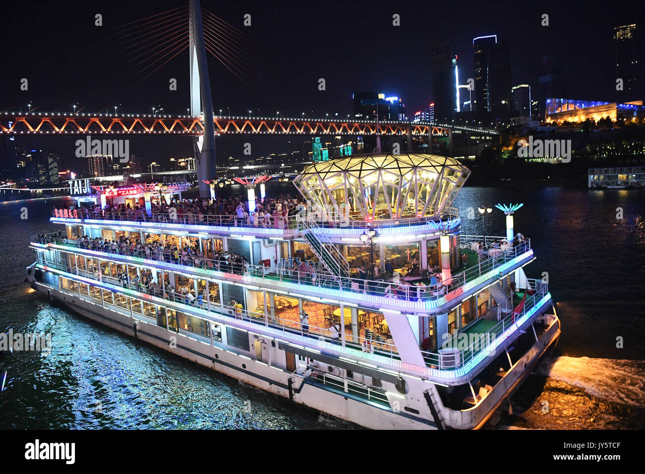 Chongqing. 18th Aug, 2017. Tourists take a sightseeing boat to view ...