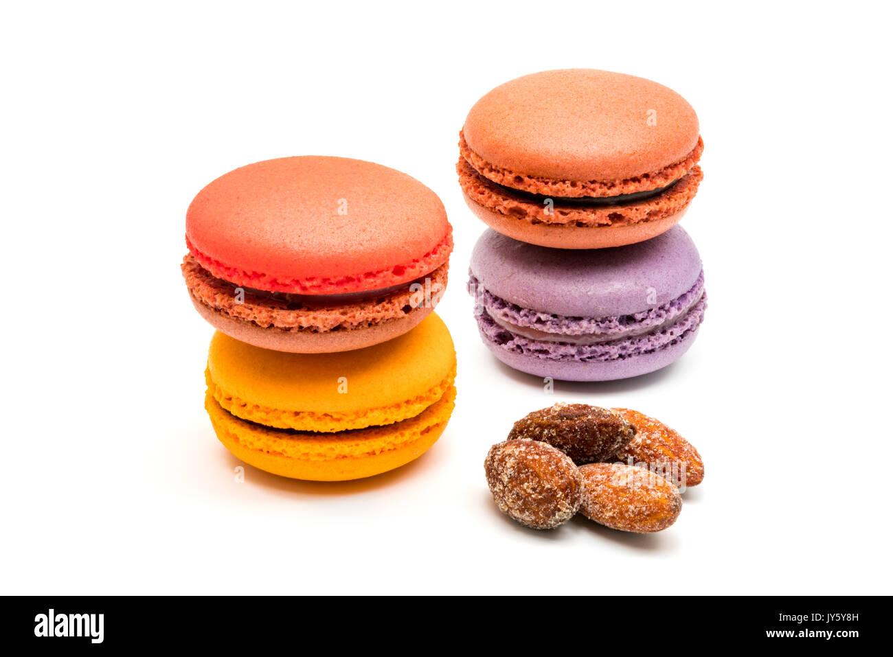 Fresh macarons and almonds on white background Stock Photo - Alamy
