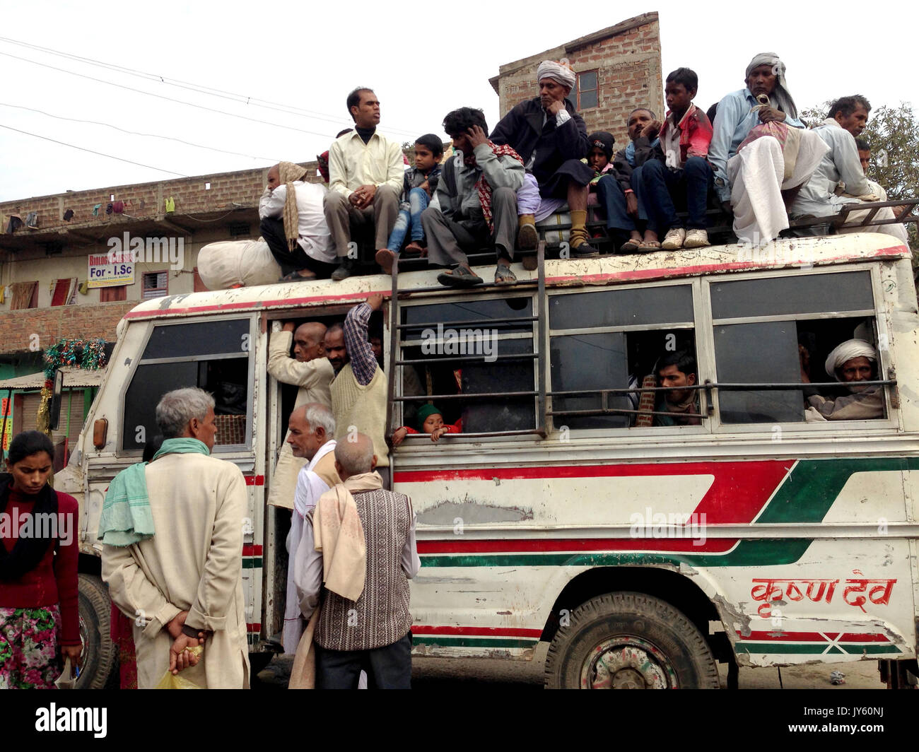 Passengers piled on top of a bus in rural India Stock Photo - Alamy
