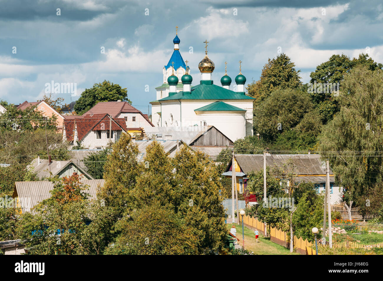 Mir, Belarus. Landscape Of Village Houses And Orthodox Church Of The ...