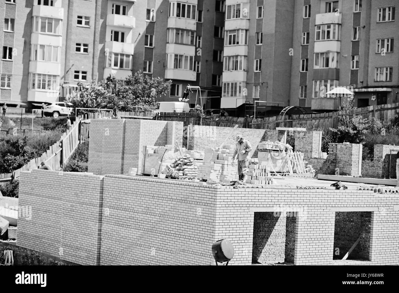 Brick house being built in the city Stock Photo - Alamy