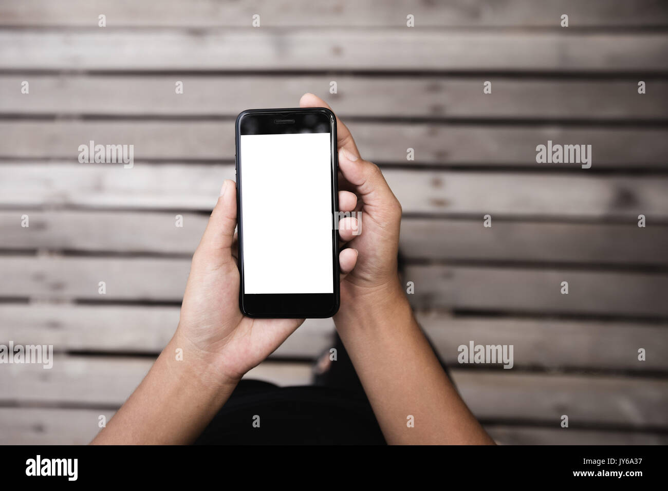 selective focus on phone in hand showing white screen Stock Photo - Alamy