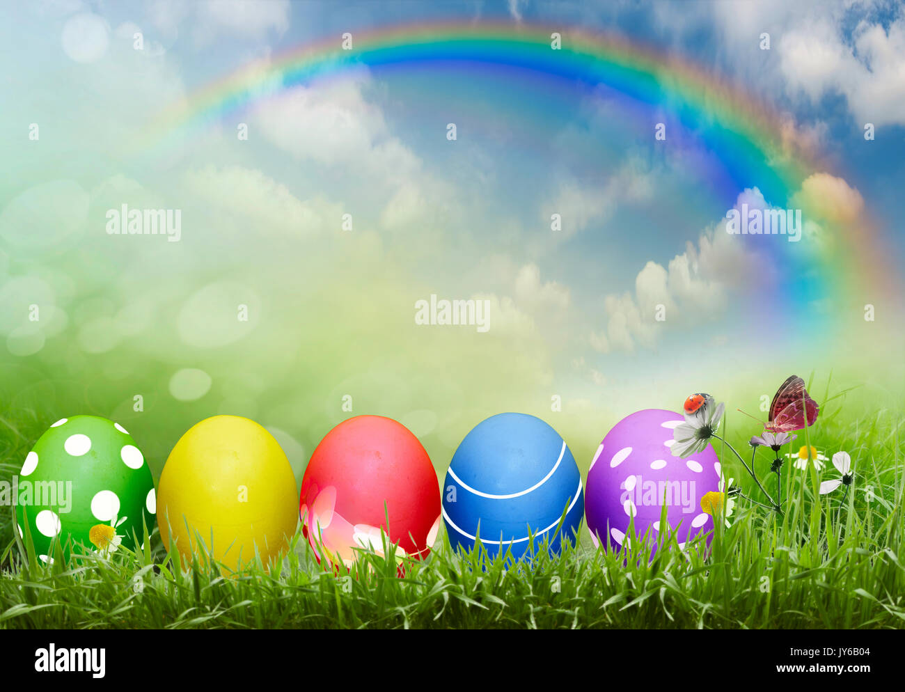 Easter eggs, dyed, with a pattern on the background of a sunny sky in ...