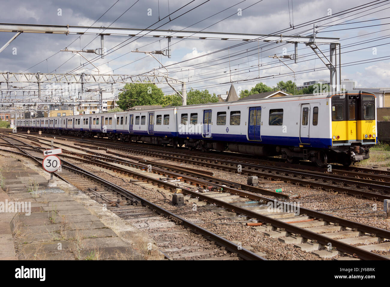 Overground train at Bethnal Green station in London Stock Photo - Alamy