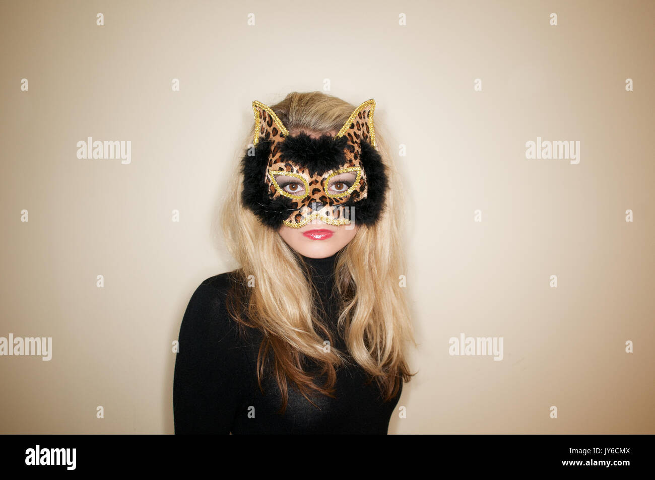 Head and shoulders of a beautiful girl wearing a mask Stock Photo - Alamy
