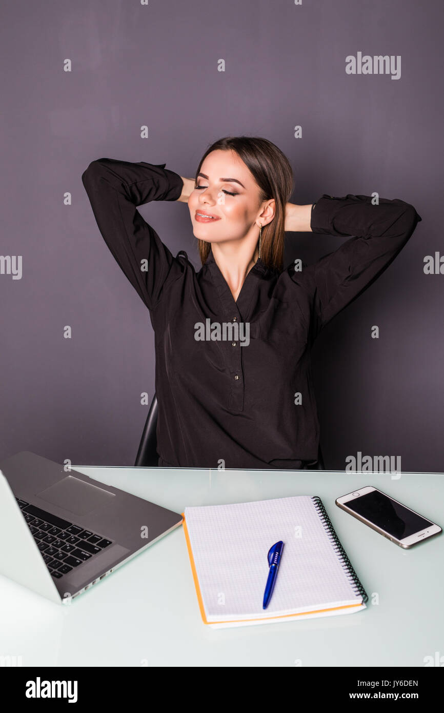 The young business woman is relaxing at work Stock Photo - Alamy