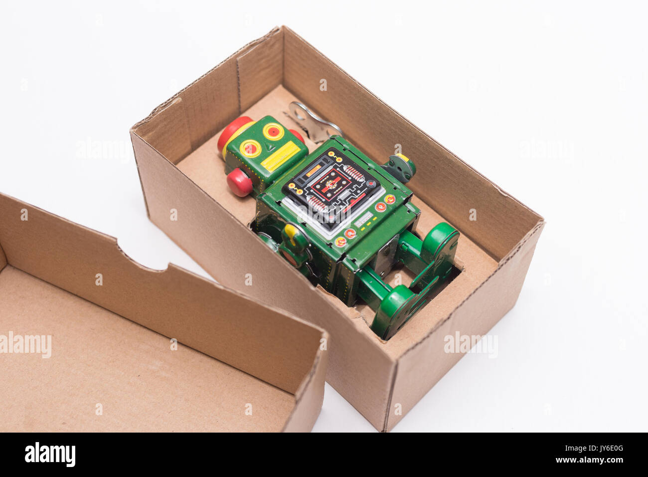 Robot in box on white background Stock Photo - Alamy