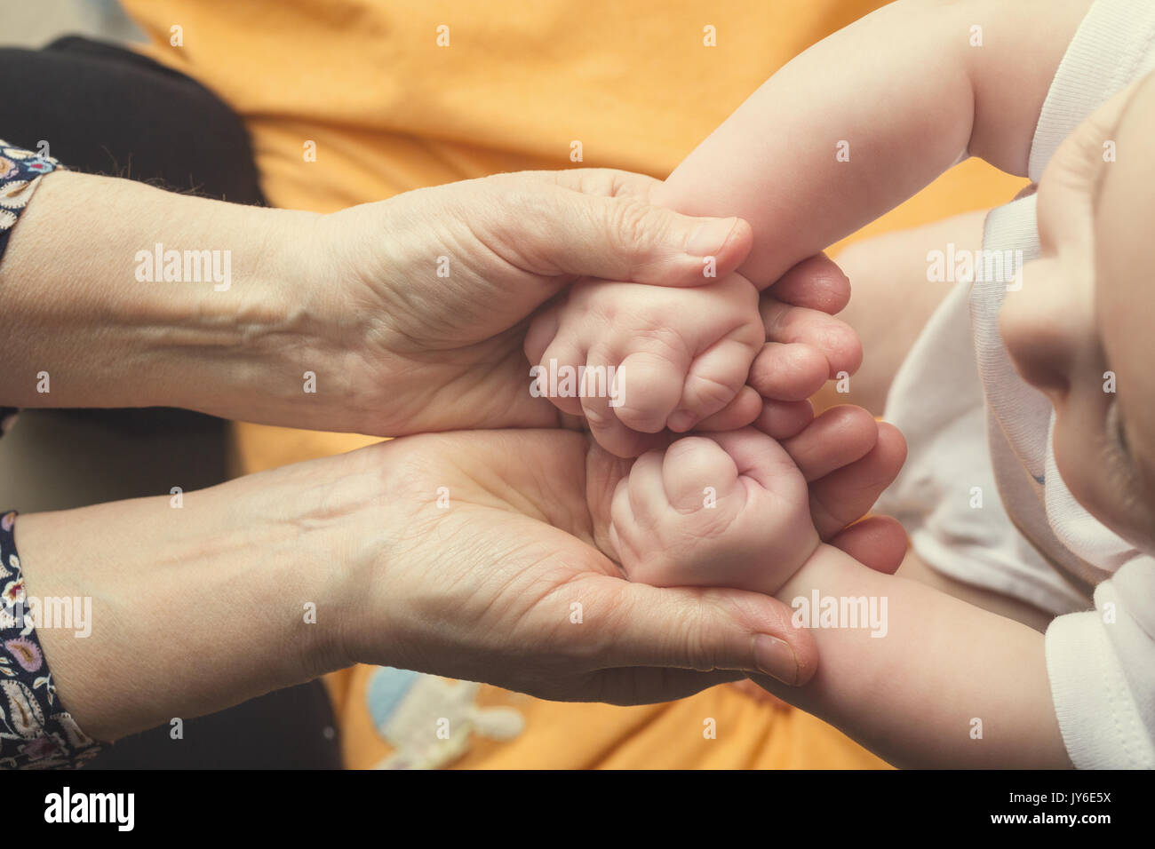 Old baby hands touching hi-res stock photography and images - Alamy