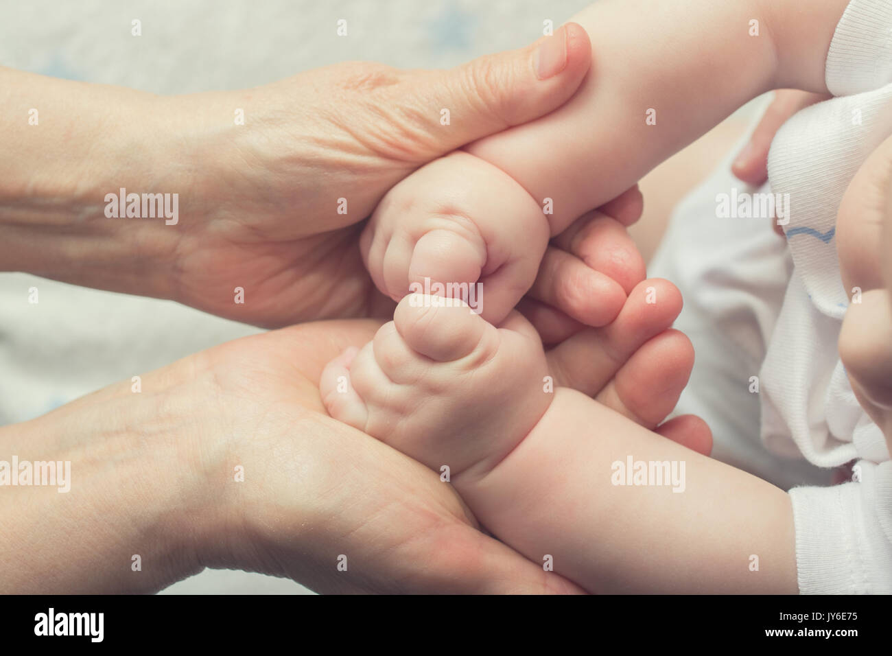 Old baby hands touching hi-res stock photography and images - Alamy