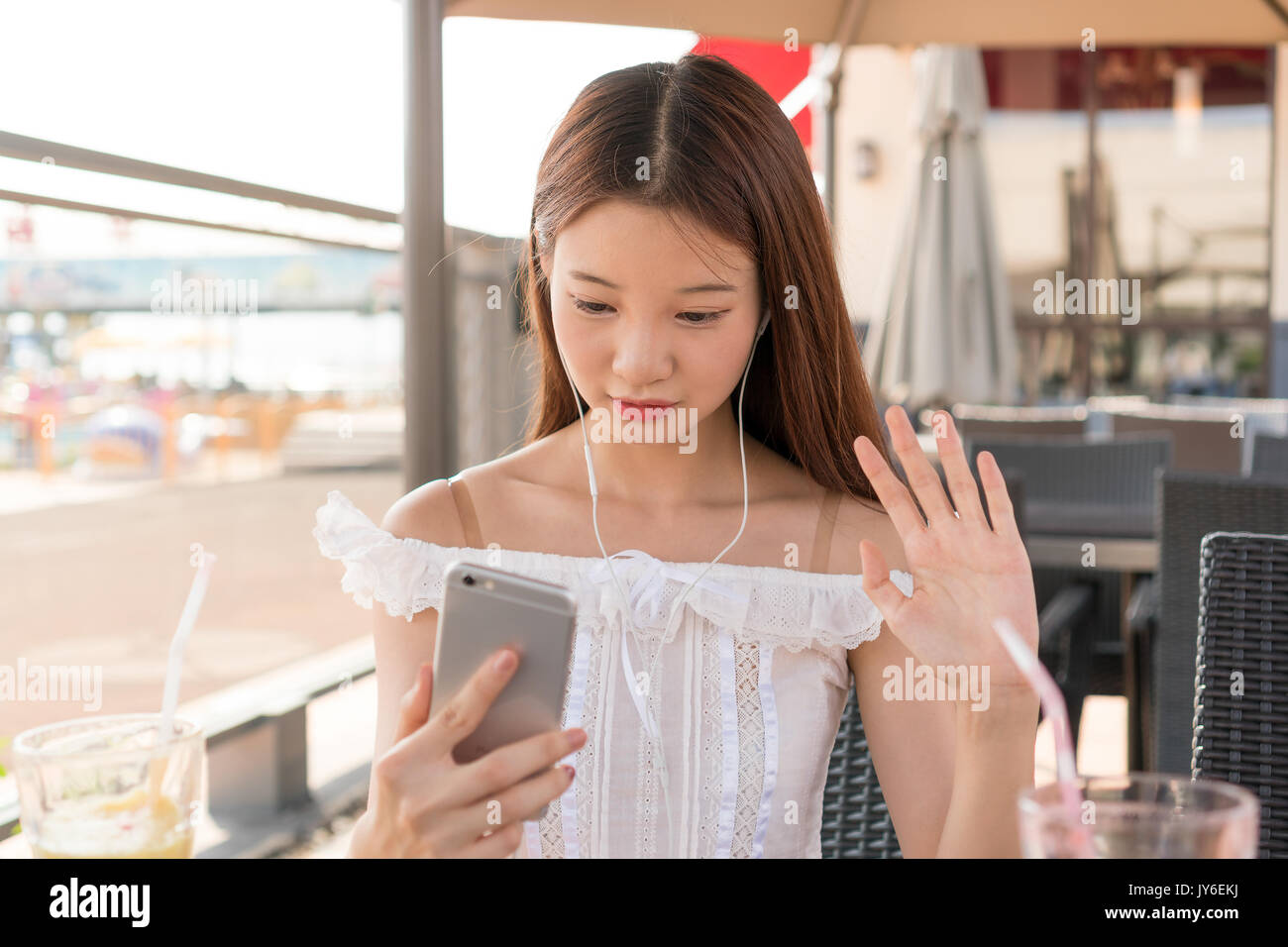 Chinese girls playing phone Stock Photo - Alamy