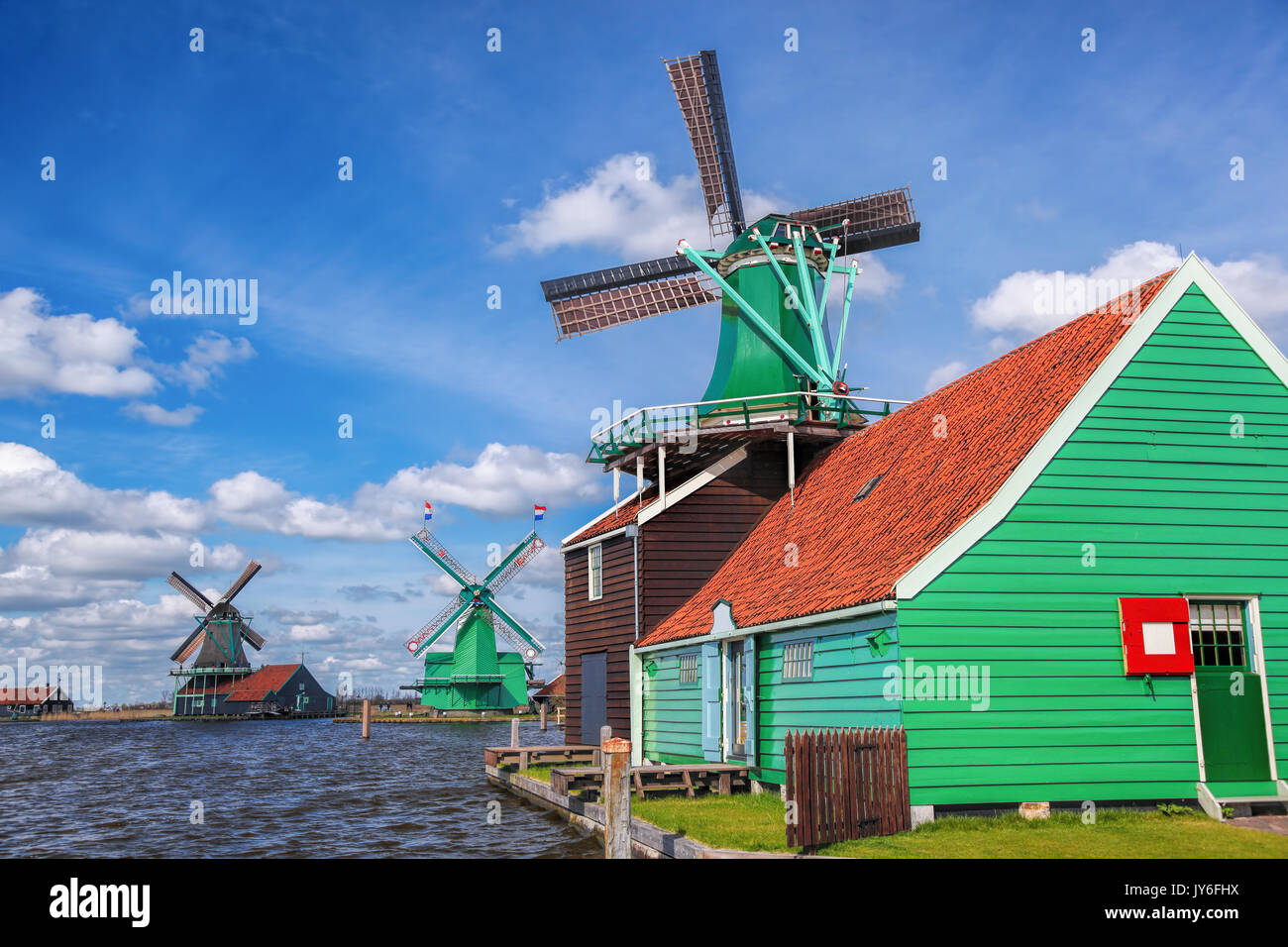 Traditional Dutch windmills with canal close the Amsterdam, Holland ...