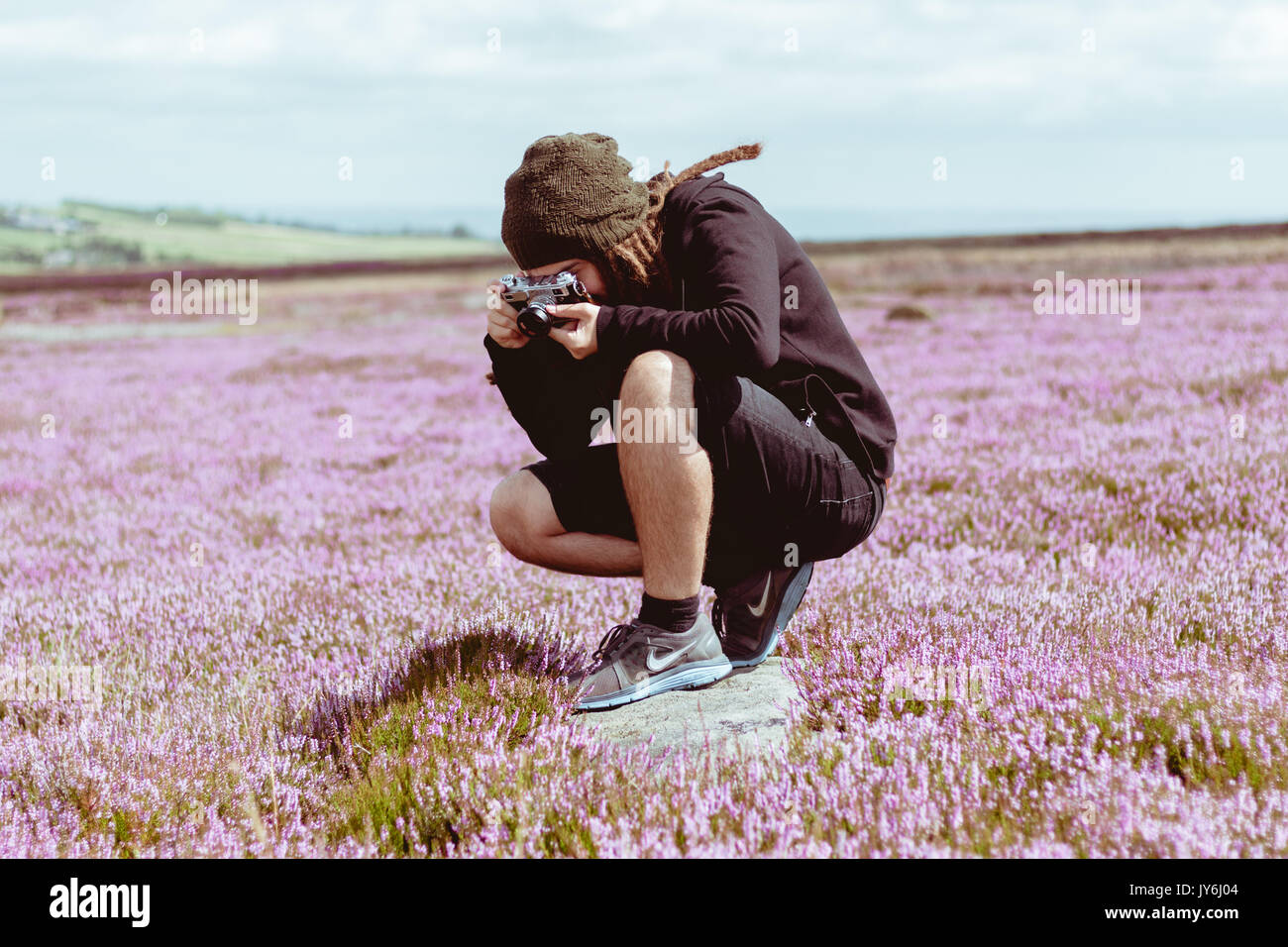 Bearded Photographer With Dreadlocks Takes Photograph With Vintage ...
