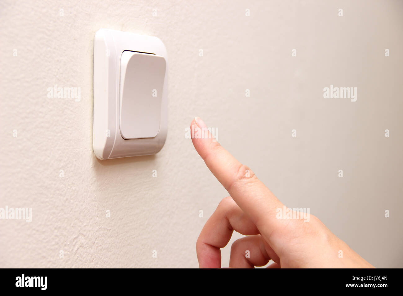 Finger press turn off electrical switch Stock Photo - Alamy