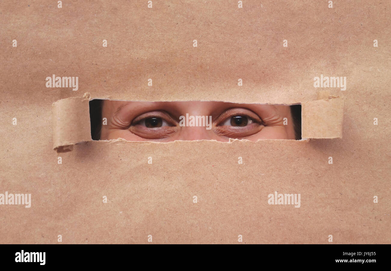 Uncovered view on ripped paper Stock Photo - Alamy