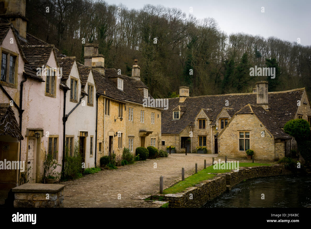 Typical quaint cottages of the village of Castle Combe in the Cotswolds ...