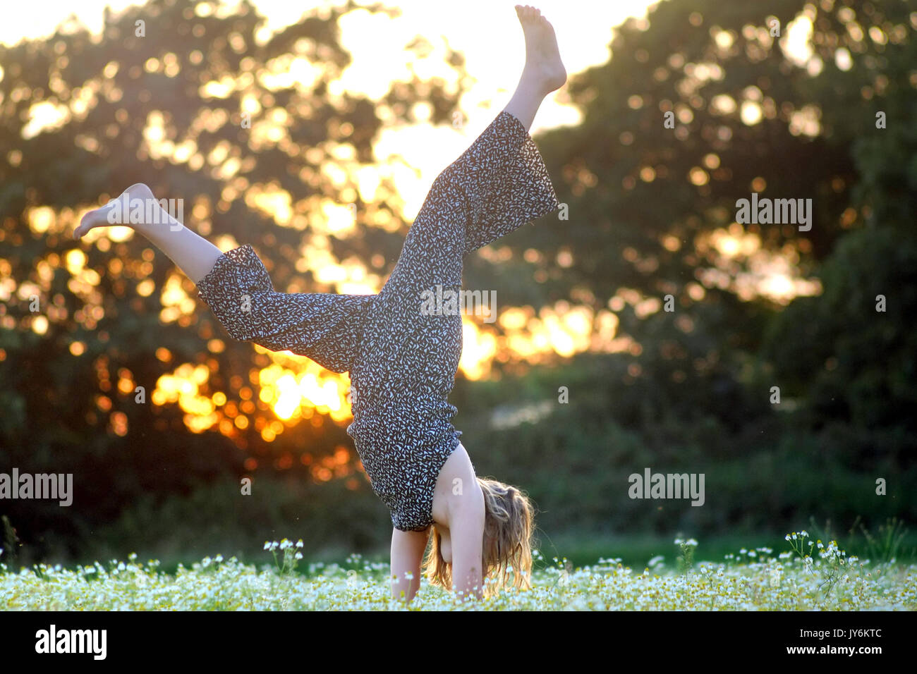 Girl doing a handstand hi-res stock photography and images - Alamy