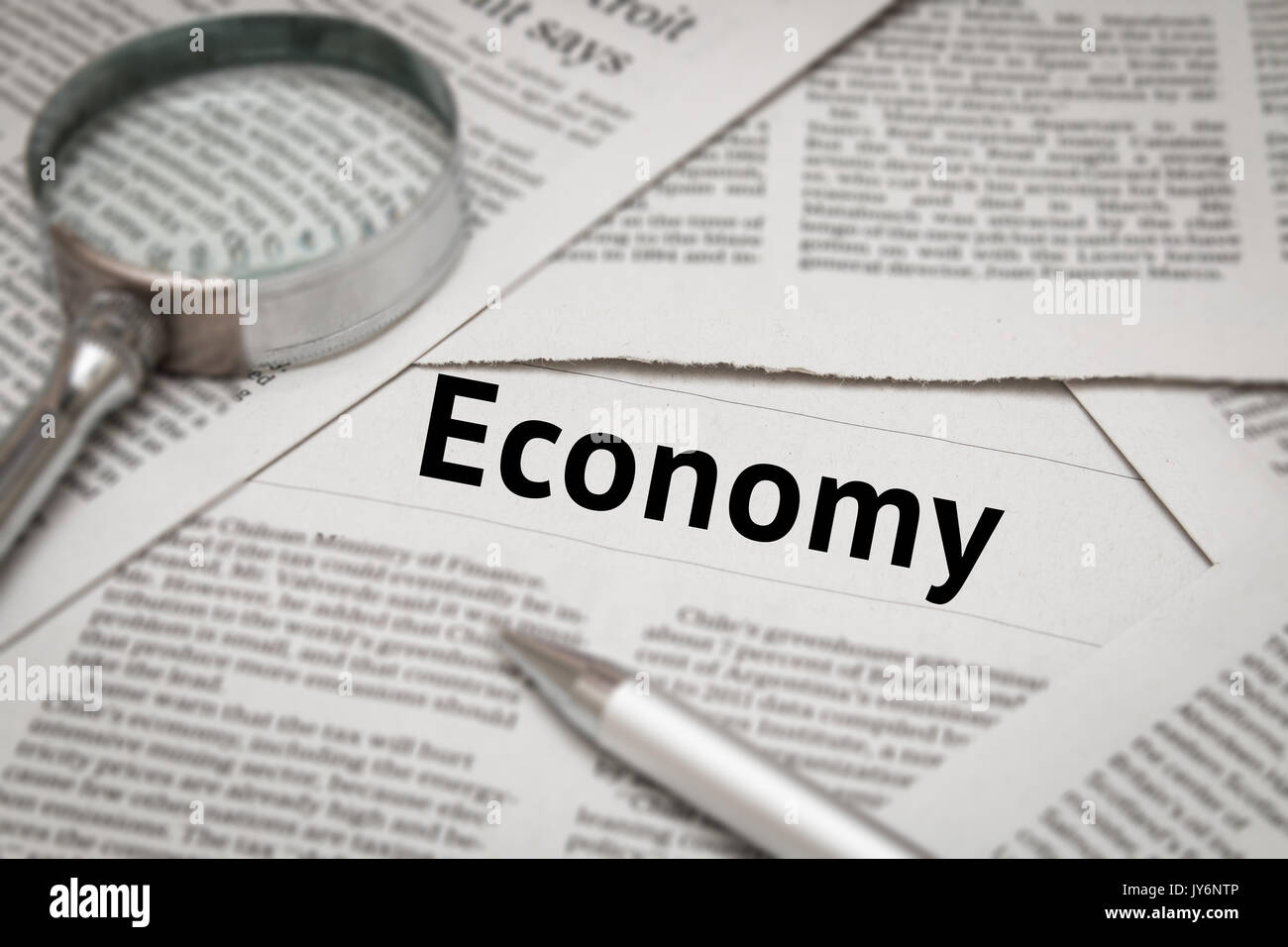 economy headline on newspaper Stock Photo - Alamy