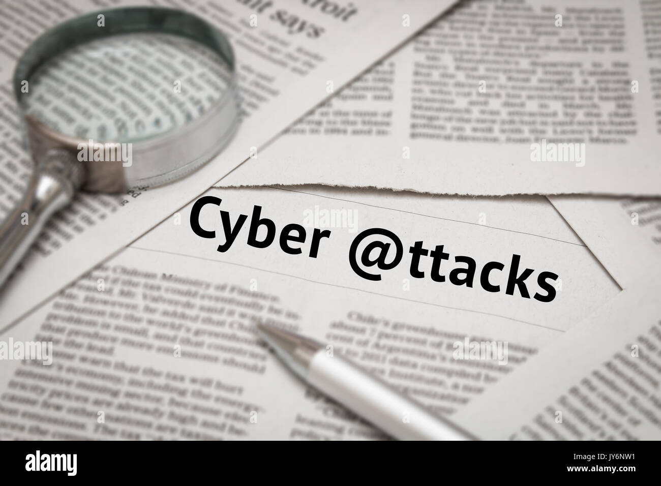 cyber attacks analysis on newspaper Stock Photo - Alamy
