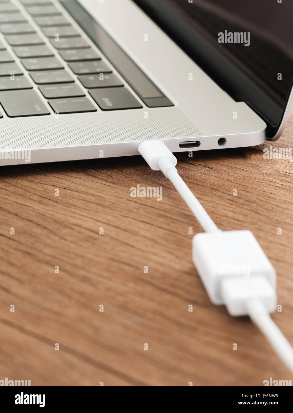 usb-c cable type connect to laptop computer Stock Photo - Alamy