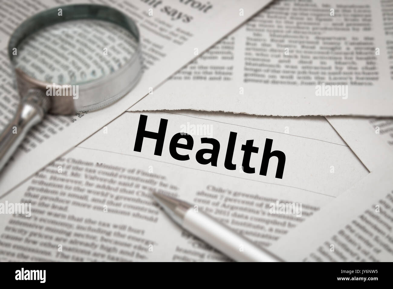 health headline on newspaper background Stock Photo - Alamy