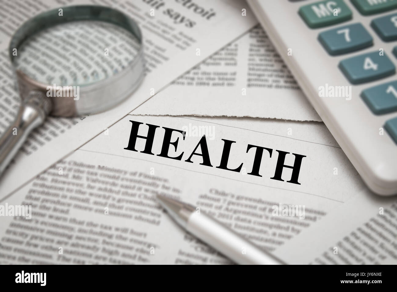 health headline on newspaper background Stock Photo - Alamy