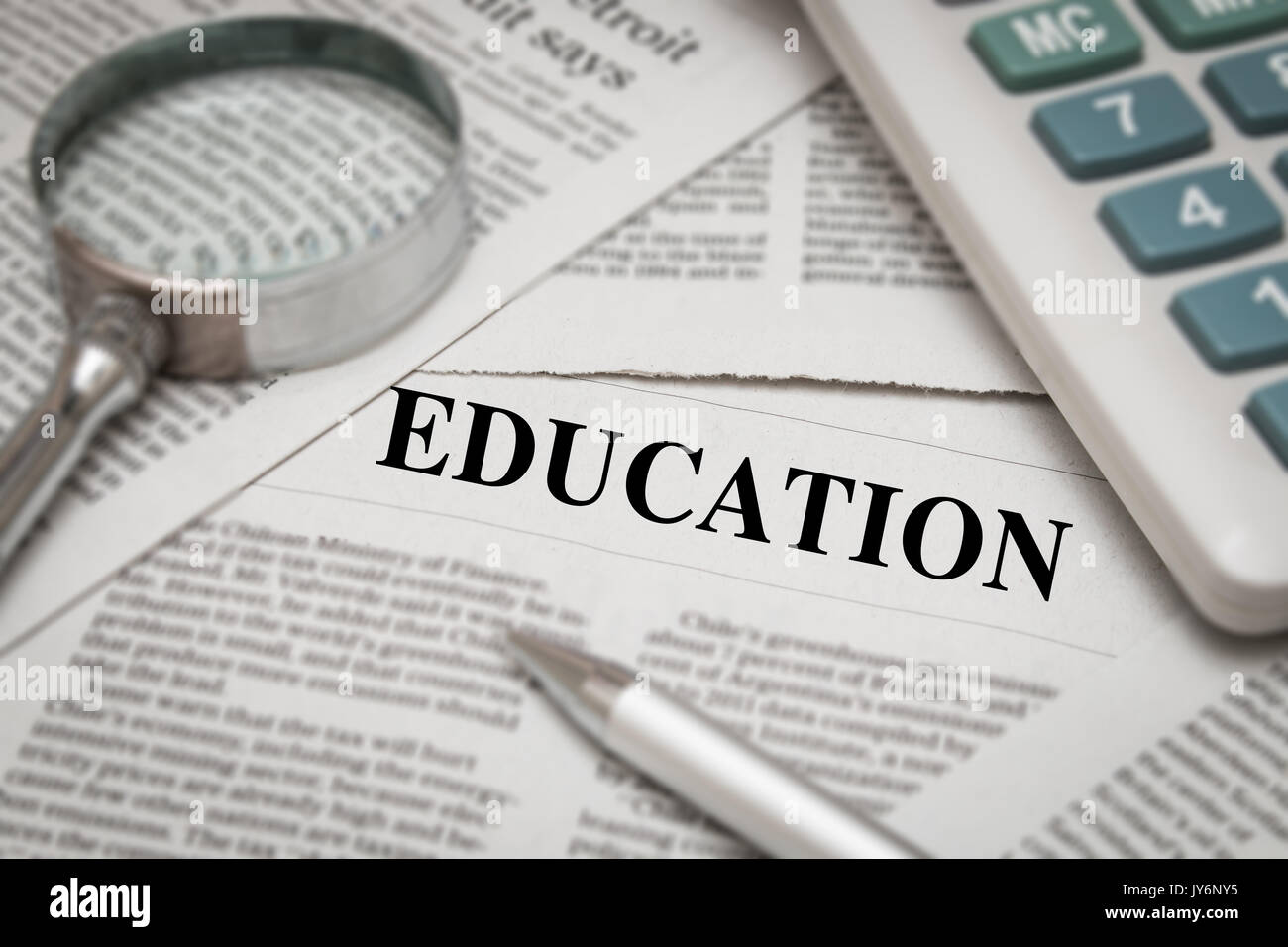 education headline on newspaper background Stock Photo - Alamy