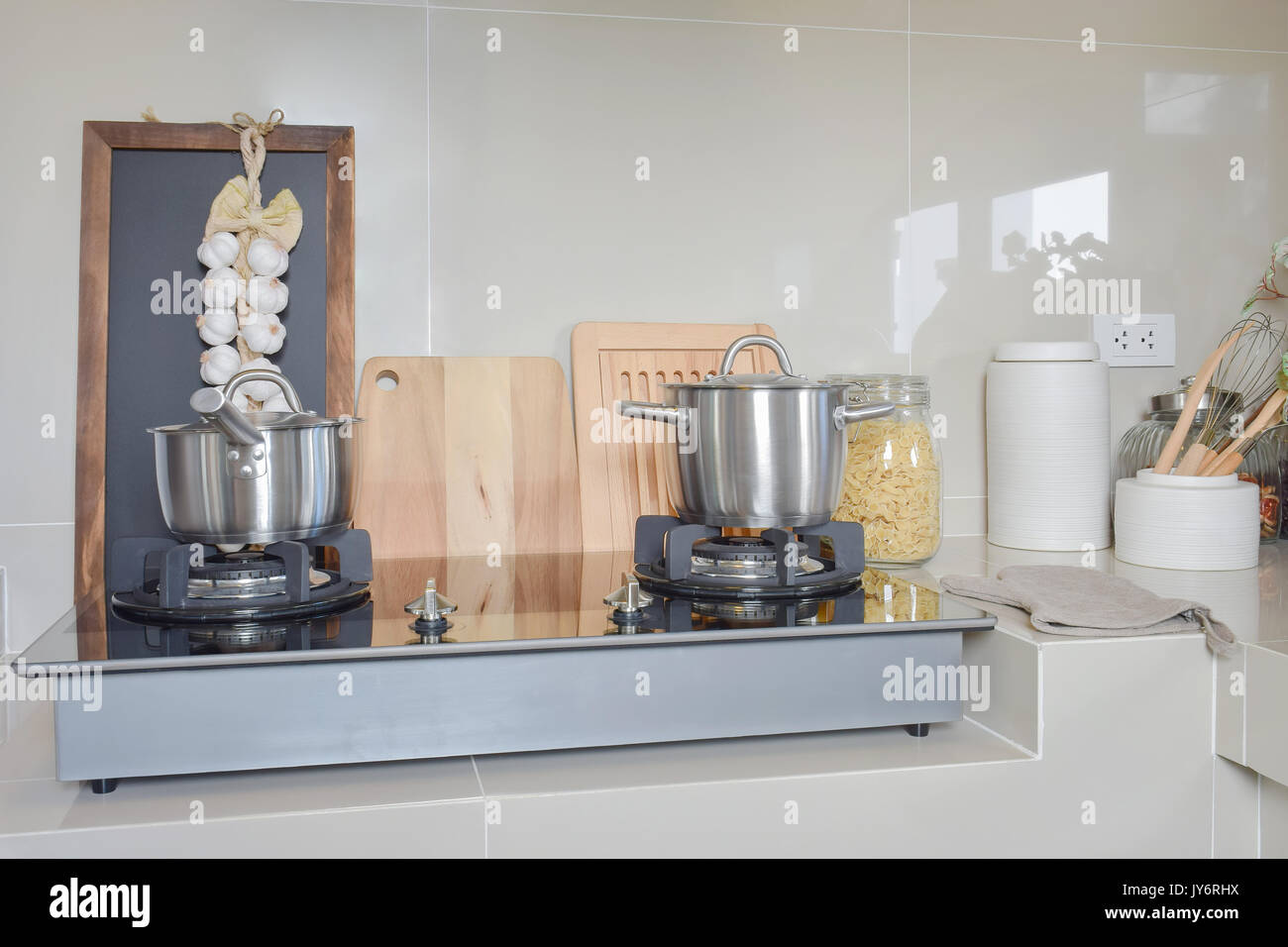 stainless pan on gas stove with utensil in modern kitchen Stock Photo ...