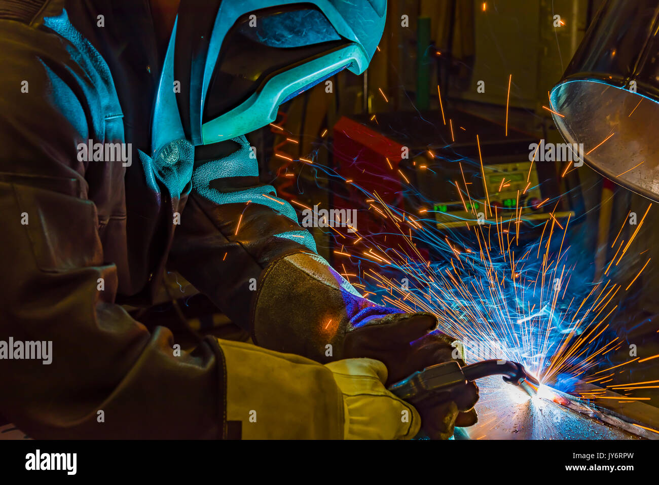 welder, craftsman, erecting technical steel Industrial steel welder in ...