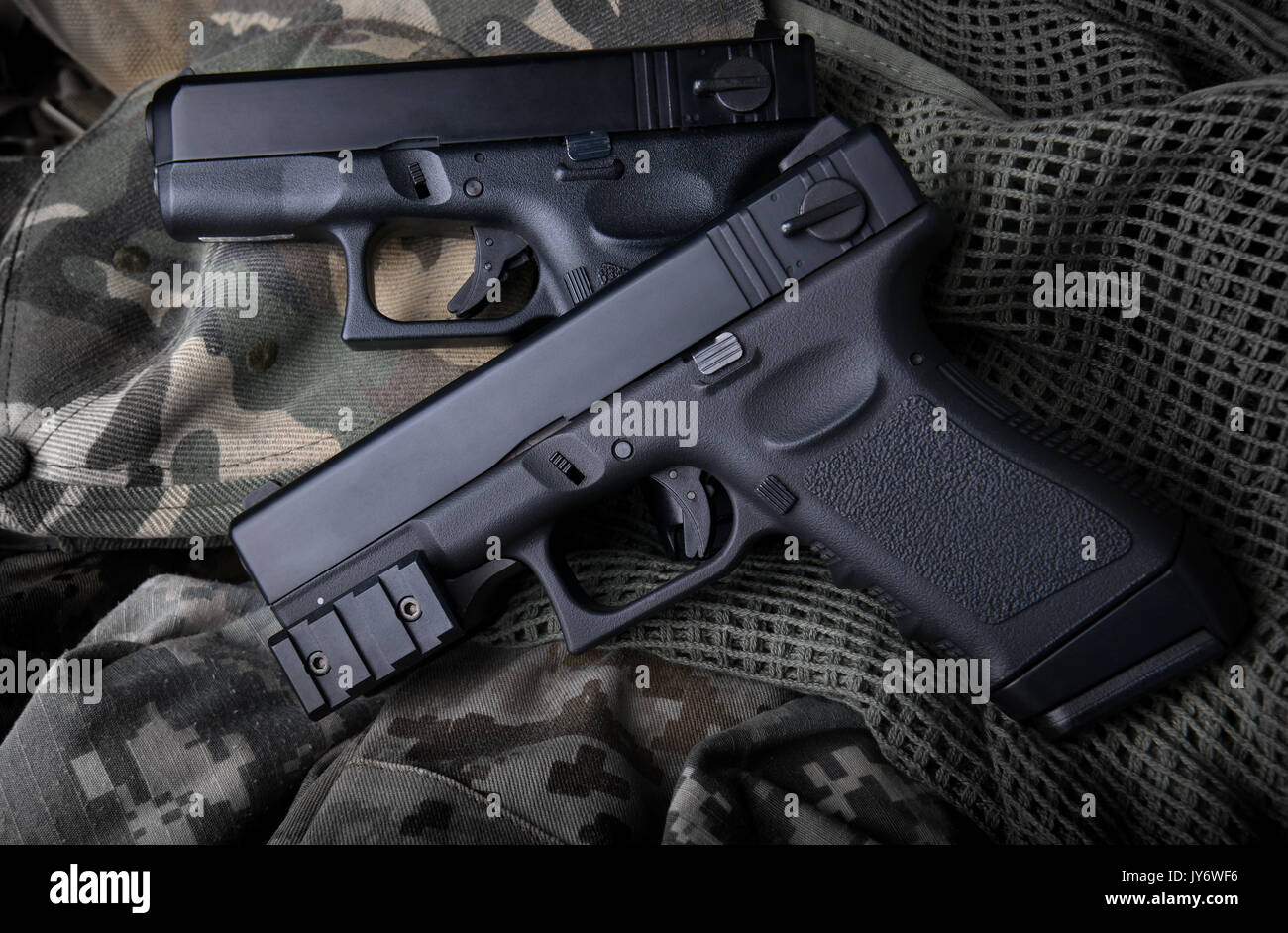 Pistal automatic short hand gun in the US army prop background photo in ...