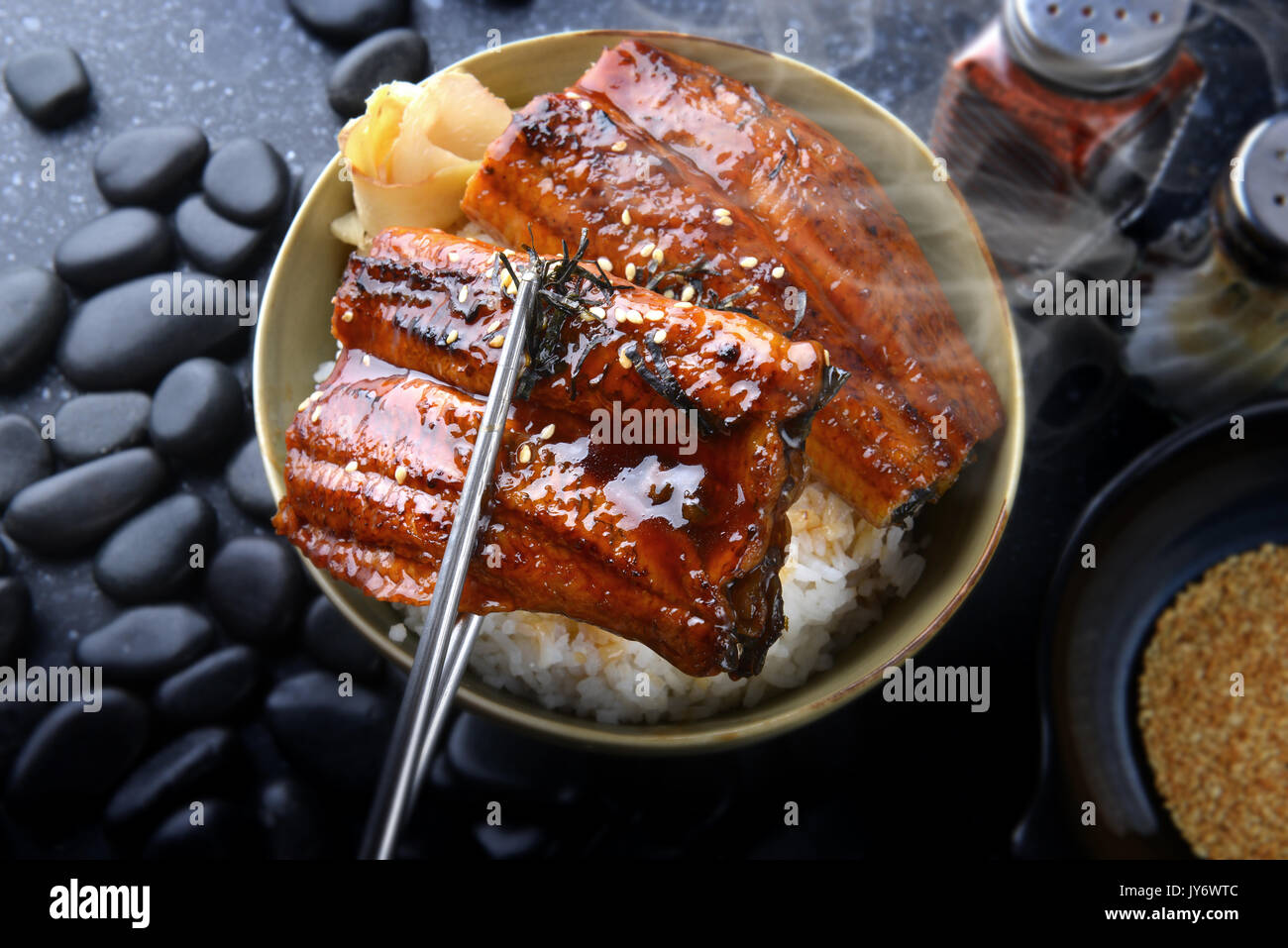 Japanese eel grilled with rice or Unagi don set on plate in Japanese style with studio lighting ...
