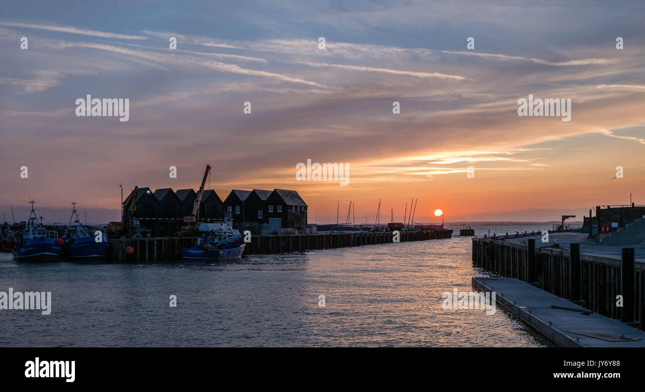 Setting sun, Whitstable harbour Stock Photo - Alamy