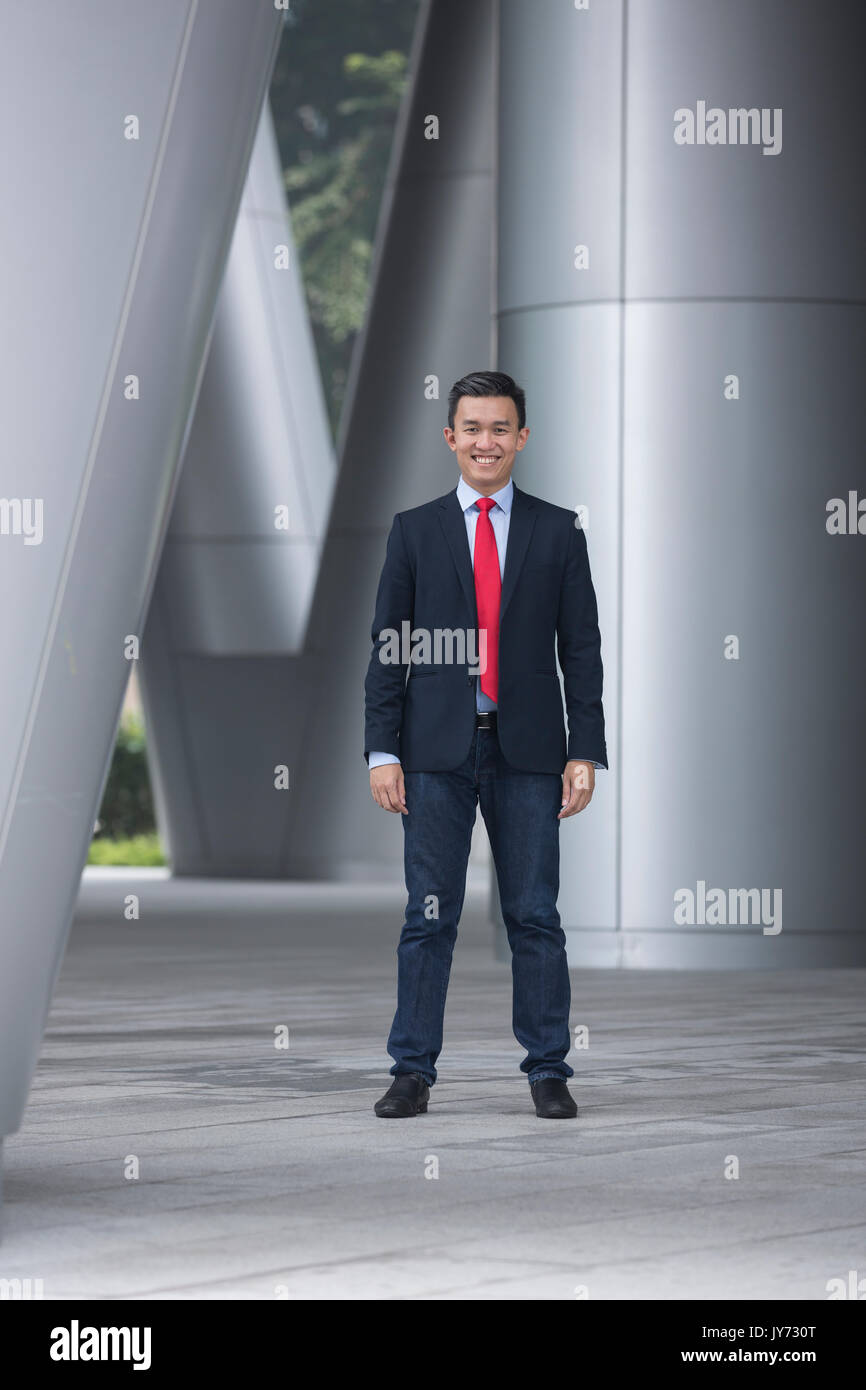 Chinese business man in modern Asian city. Portrait of an Asian ...