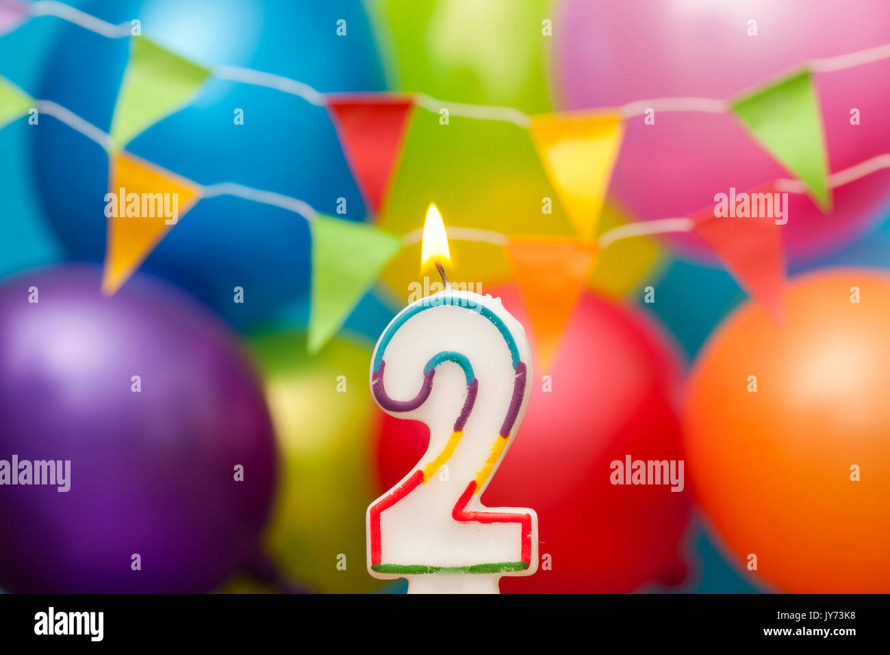 Happy Birthday number 2 celebration candle with colorful balloons and ...