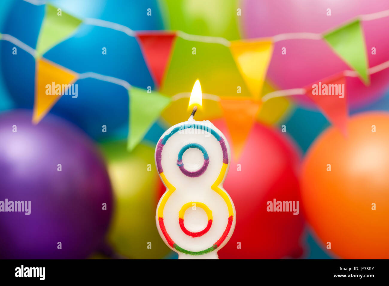 Happy Birthday number 8 celebration candle with colorful balloons and ...