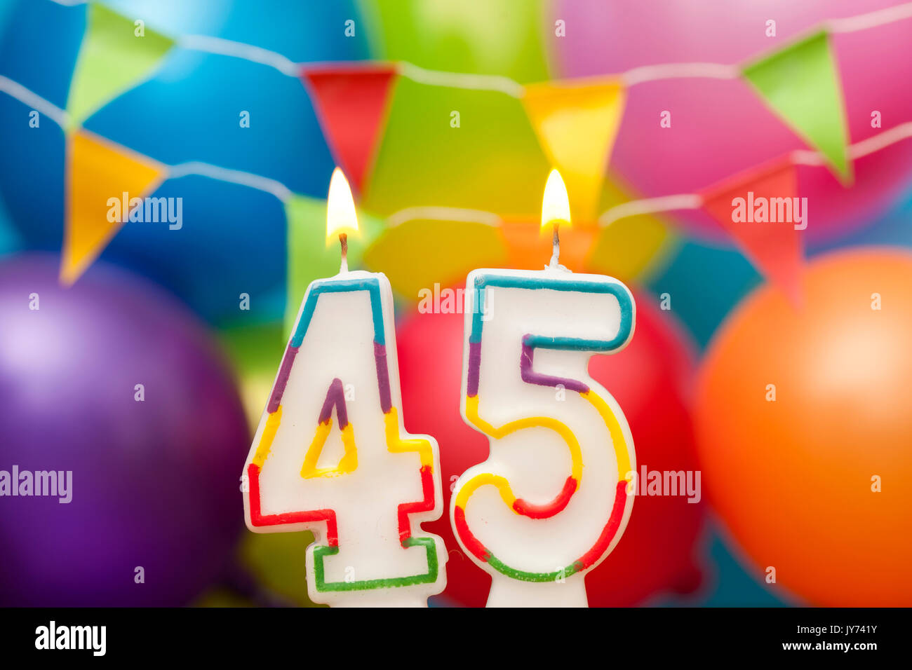 Happy Birthday number 45 celebration candle with colorful balloons and ...