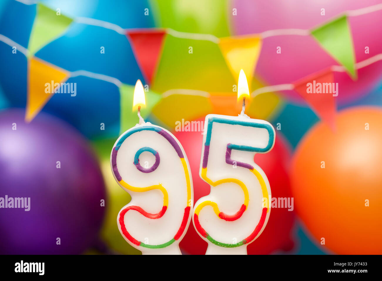 Happy Birthday number 95 celebration candle with colorful balloons and ...