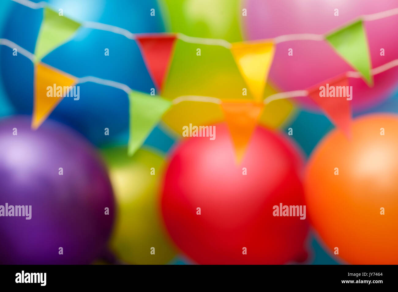 Blurred celebration background with colorful balloons and bunting Stock ...