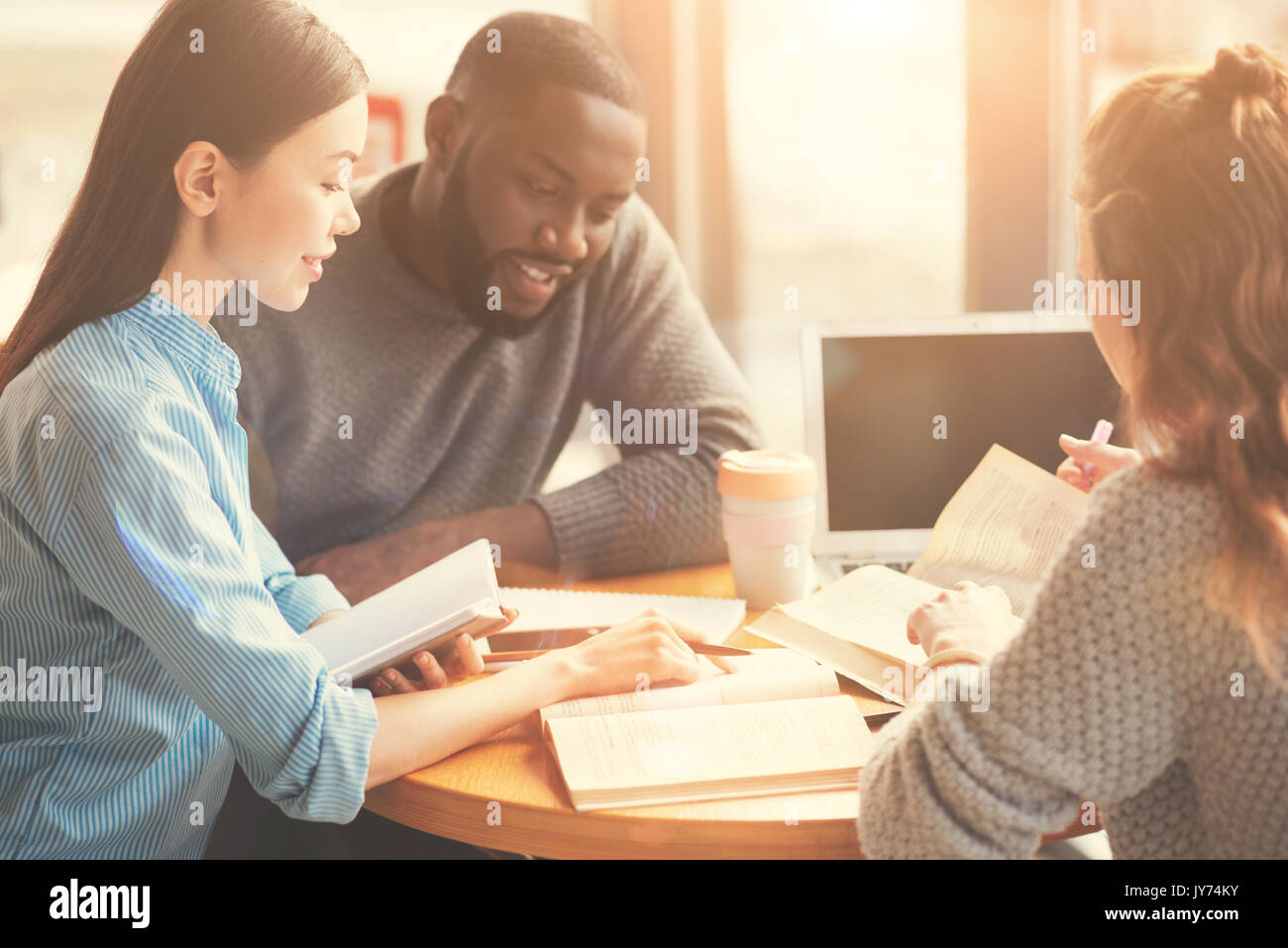 Positive students studying tpgether Stock Photo - Alamy